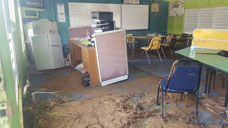 Flood water knocks out wall -School badly affected